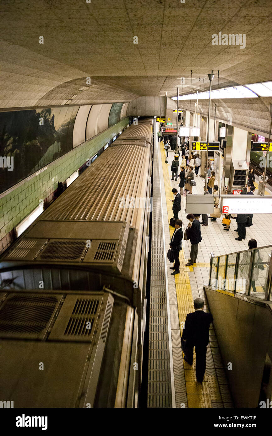Interior of Japanese subway station in Osaka. Overhead view of people ...