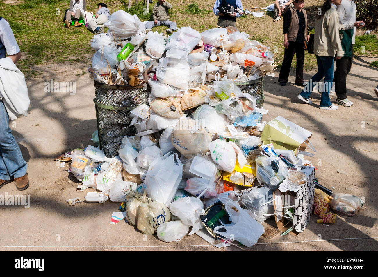 Piles and plastic bags full of rubbish and garbage piled around litter ...