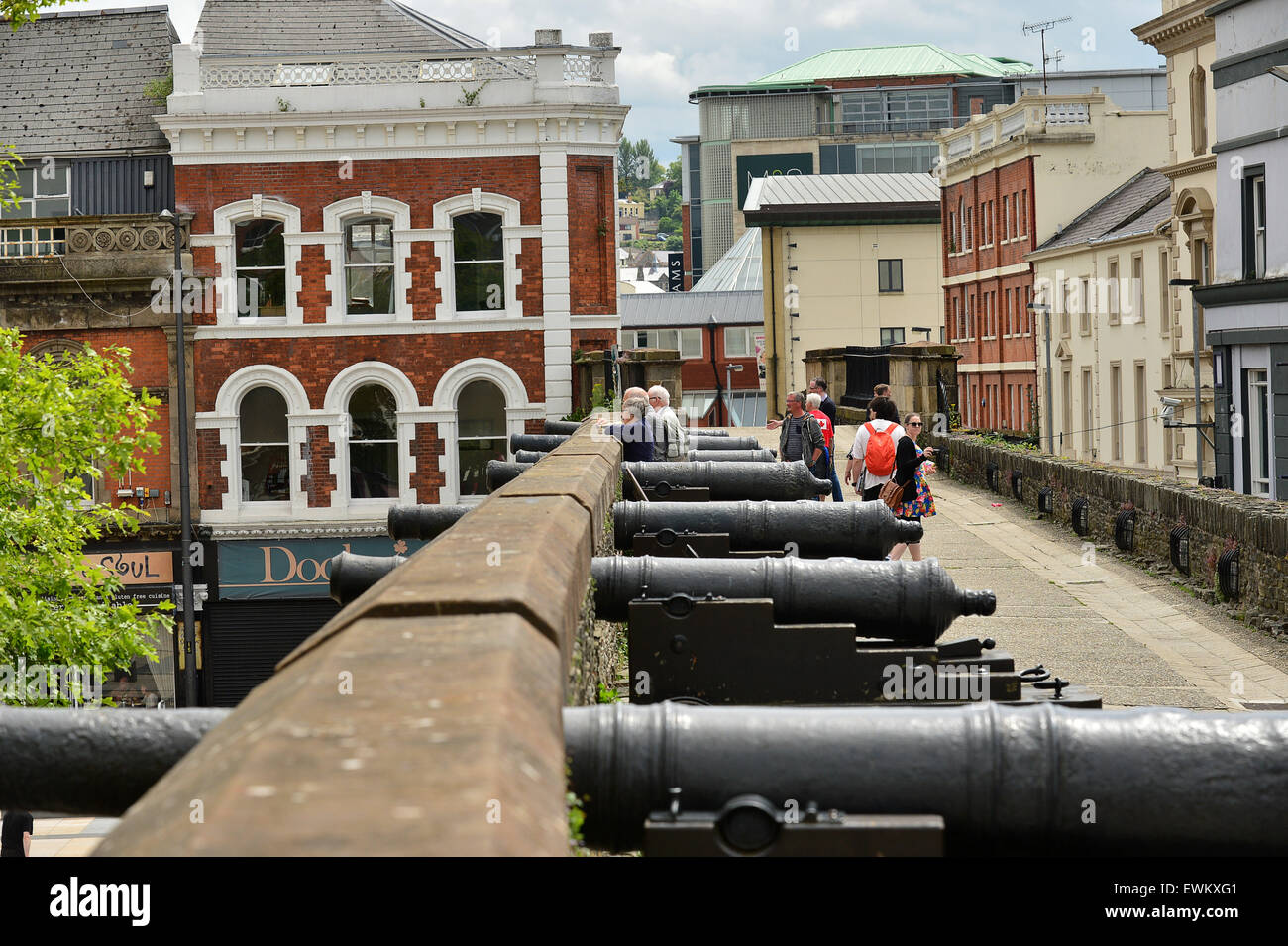 Tourists walk on the 17th century Derry Walls in Londonderry, Northern ...