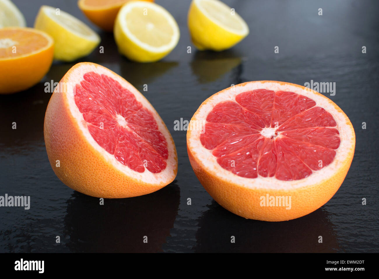 Fresh sliced grapefruit on a slate platter Stock Photo - Alamy