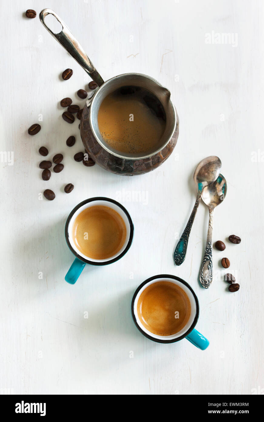 Cups of coffee and coffee pot. Top view Stock Photo - Alamy