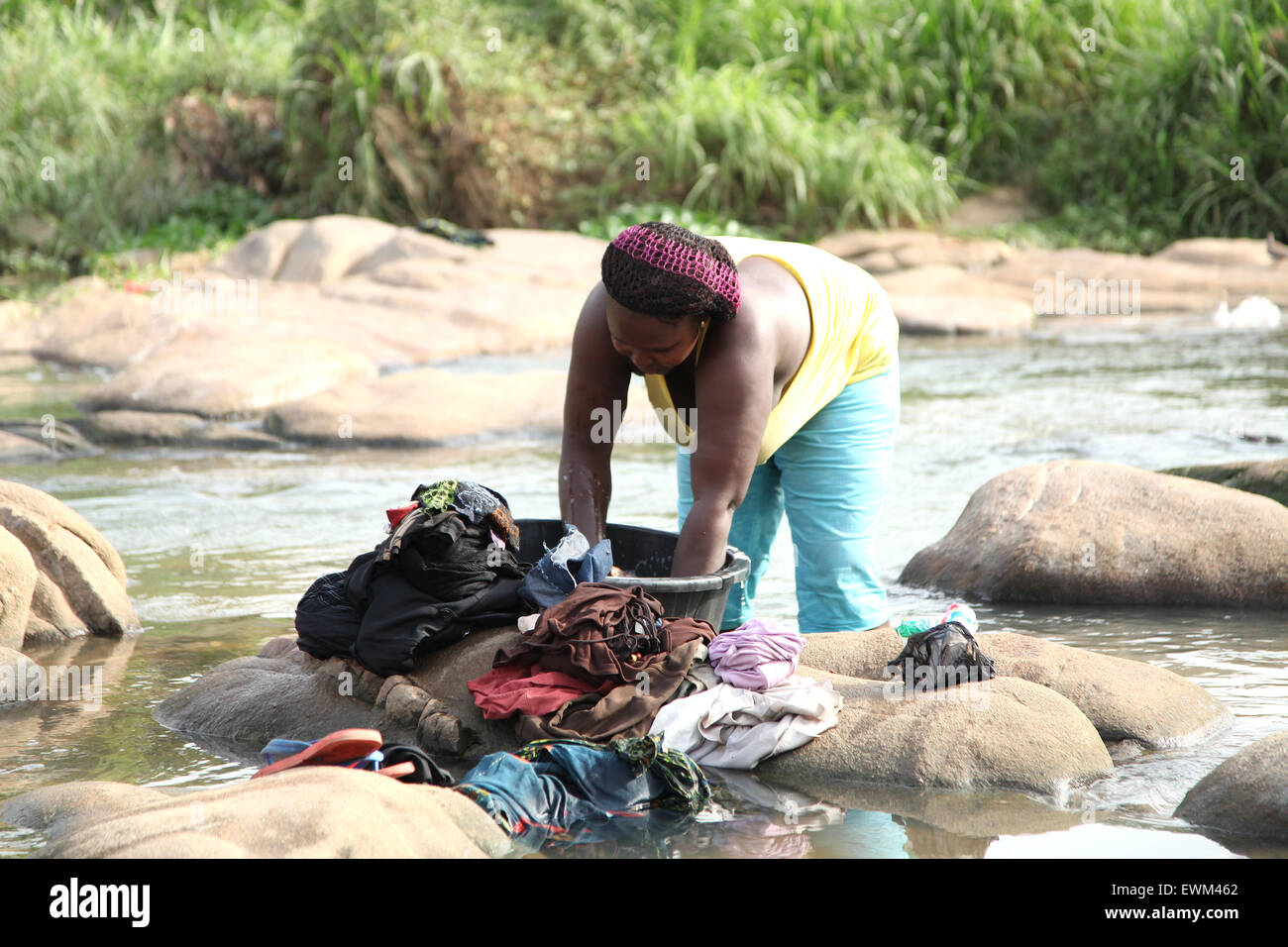 Women cleaning their clothes at the river in Zuba in Nigeria. It is so ...