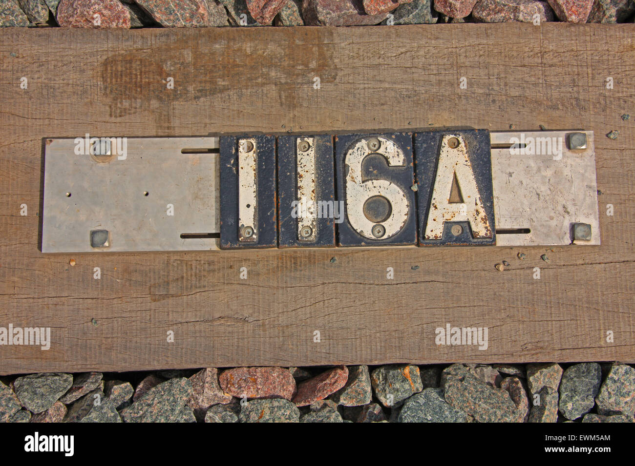 A series of Cast Iron numbers and a letter painted in black and white ...