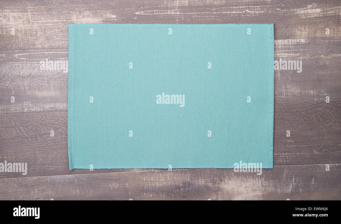 Place mat on wooden deck table Stock Photo - Alamy
