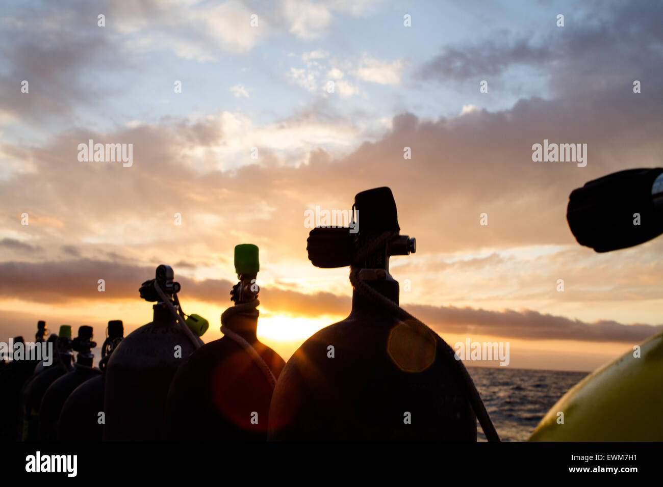 Scuba tanks are silhouetted by a beautiful sunset in California Stock ...