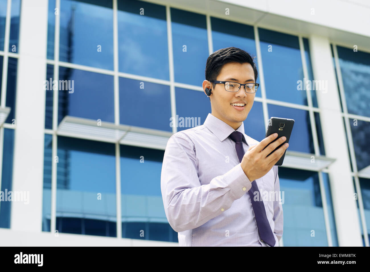 Young chinese businessman doing video conference call on smartphone and ...