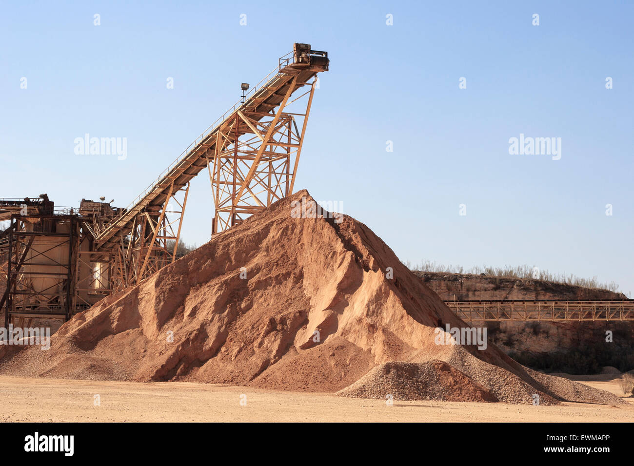 Rock quarry conveyor belt and material stockpile Stock Photo - Alamy