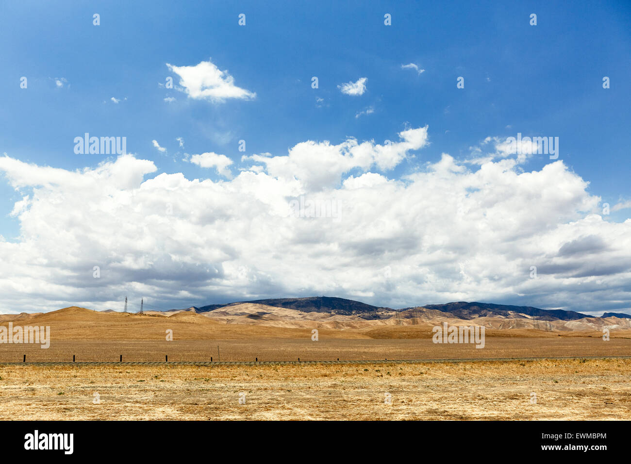 Dramatic photograph of an empty expanse of dry grass with a view of ...