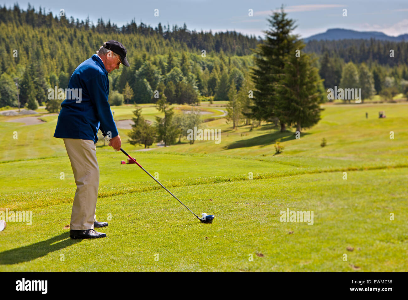 Retired senior man playing golf at Seven Hills Golf & Country Club on ...