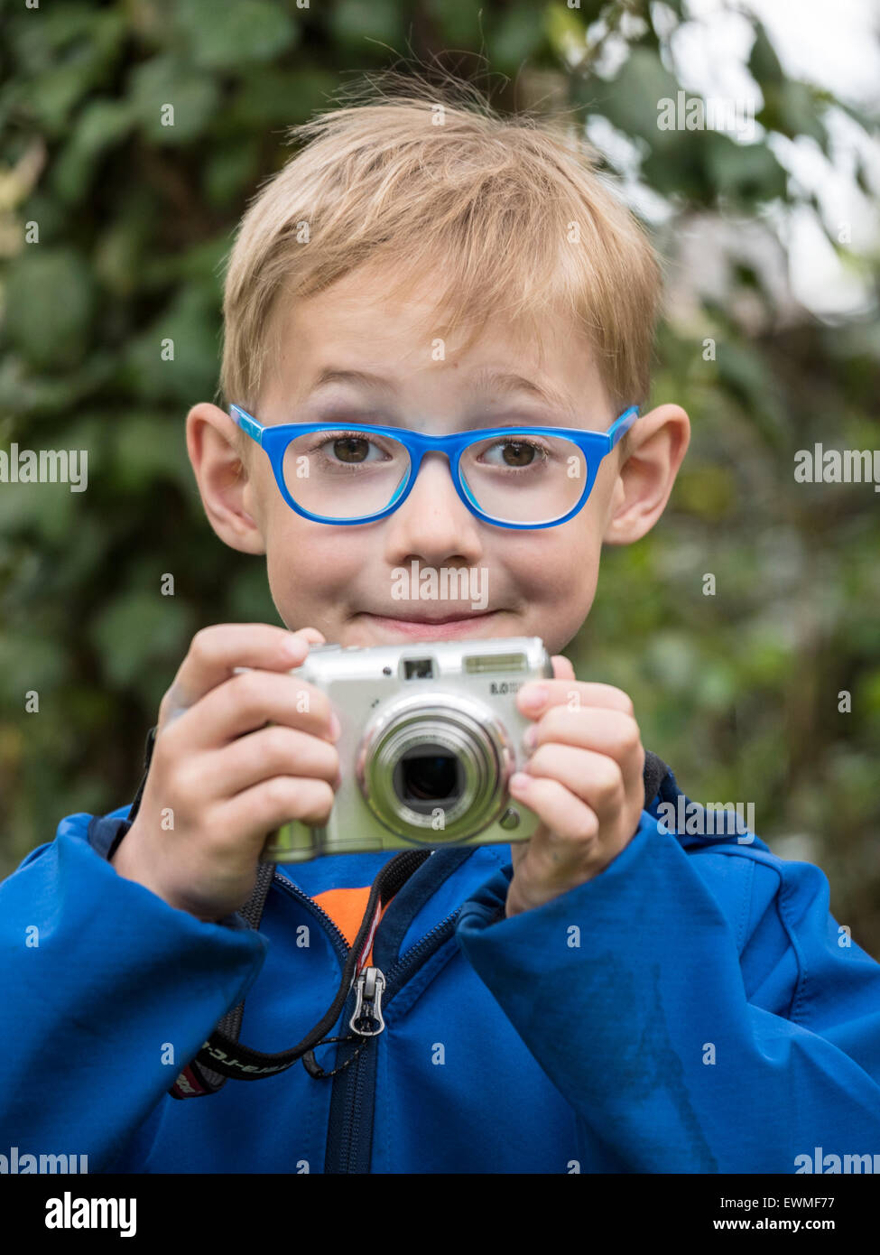 Boy with compact camera Stock Photo - Alamy