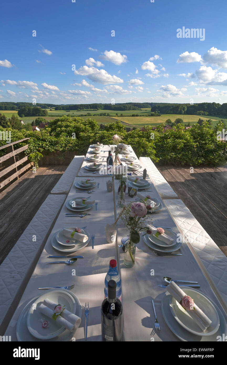 Nicely laid table in front of the Franconian Switzerland countryside ...