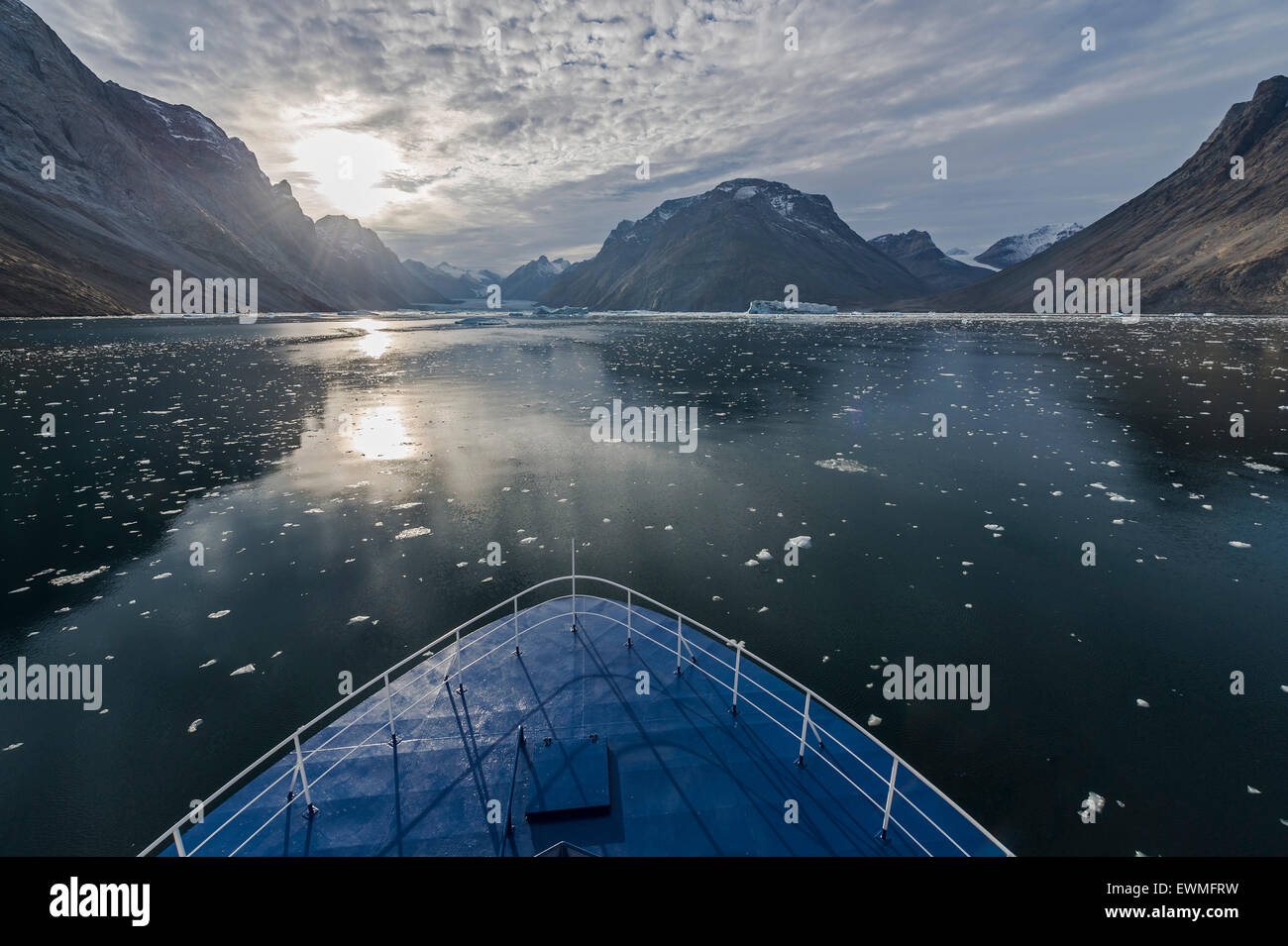 Expedition ship sailing through ice floes, mountains in the Kaiser ...