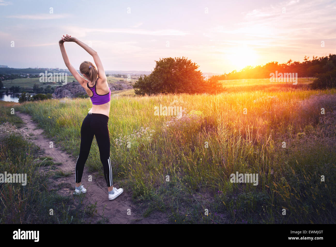 Silhouette woman hands up standing hi-res stock photography and images ...