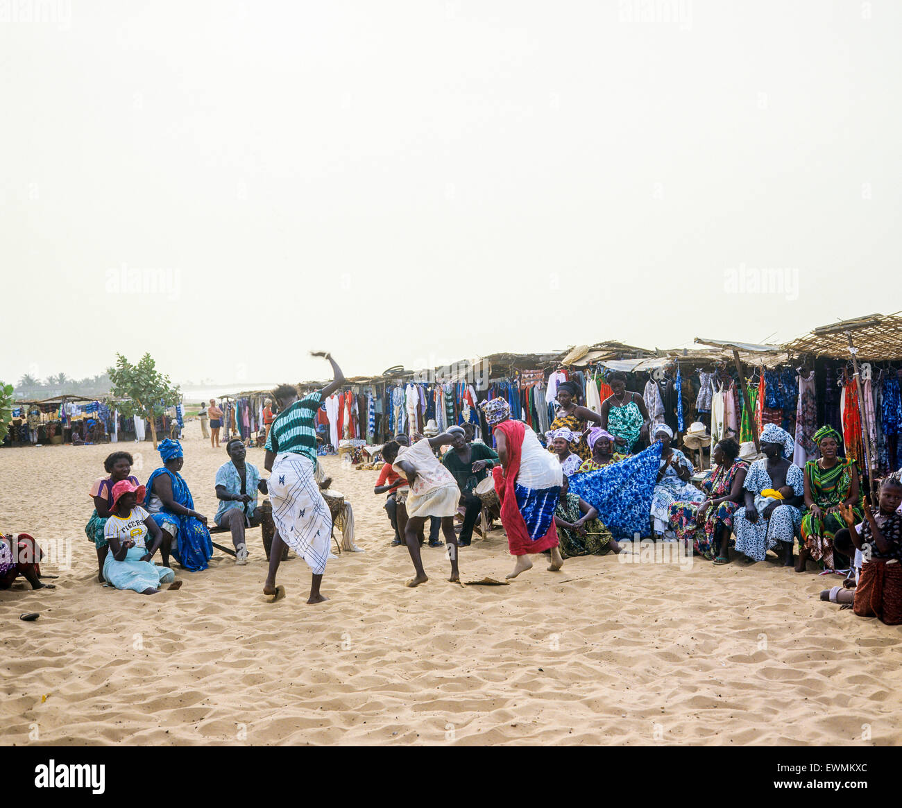 Gambian women dancing and beach merchant stalls, Kotu beach, Gambia ...