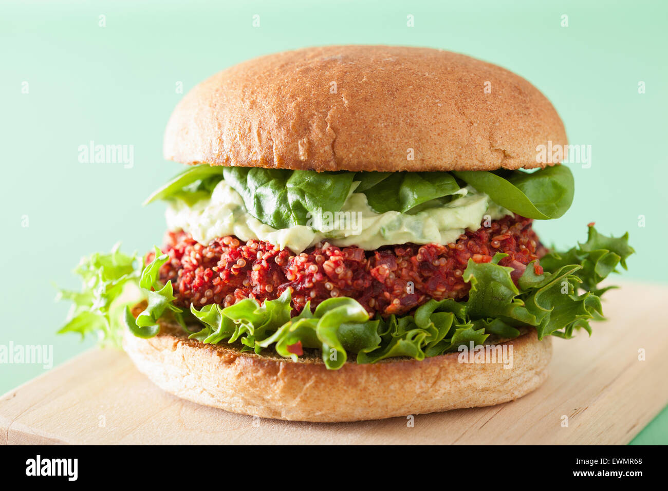 vegan beet and quinoa burger with avocado dressing Stock Photo - Alamy