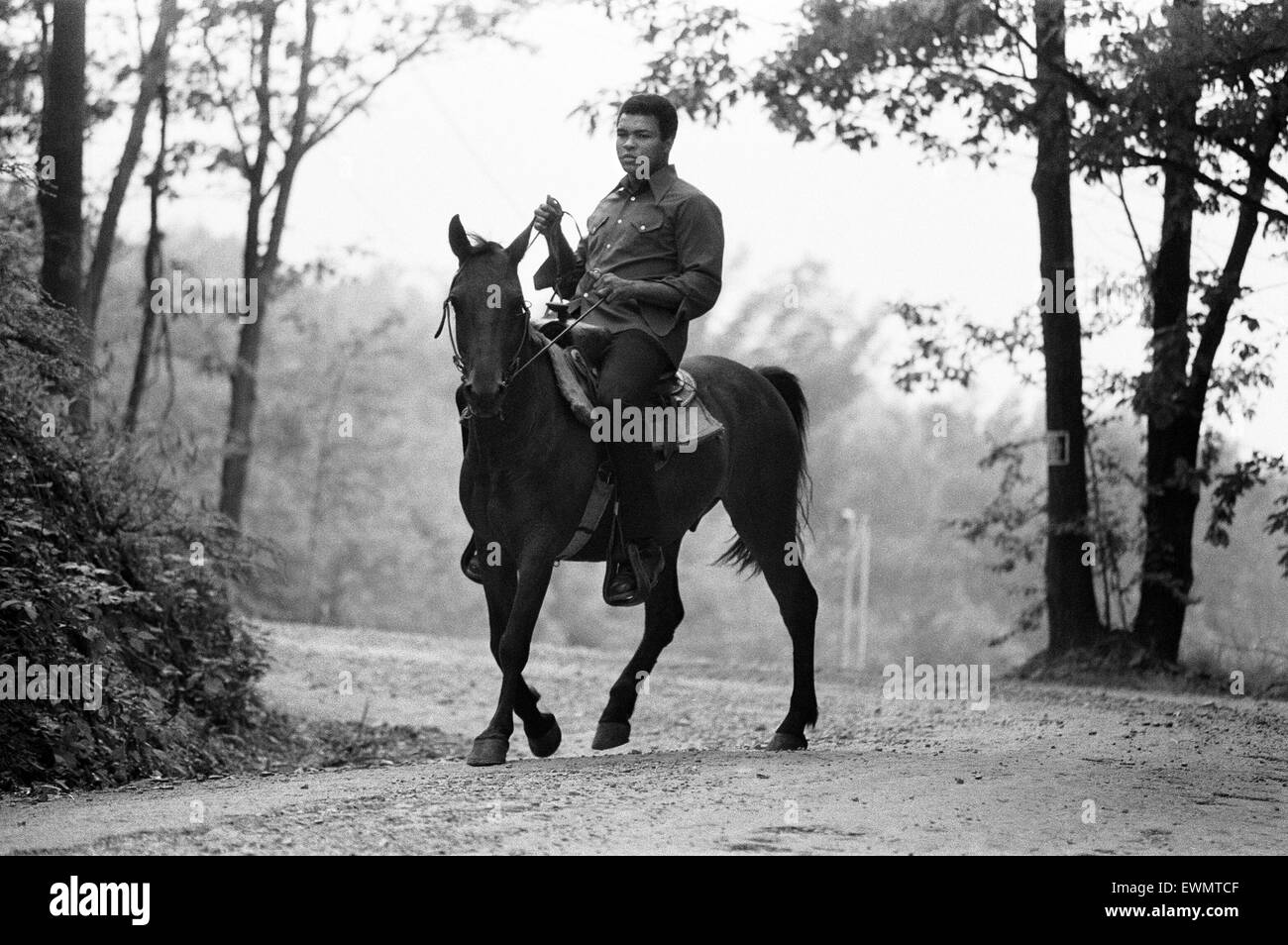 Muhammad Ali riding a horse in Deer Lake Pennsylvania. 5th July 1973 ...