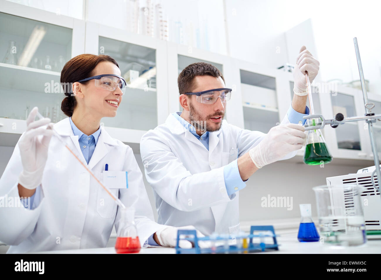 Scientists in laboratory chemical tubes hi-res stock photography and ...