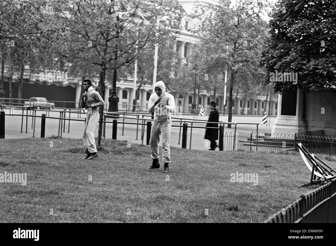 Cassius Clay aka (Muhammad Ali) and sparring partner James Ellis shadow ...