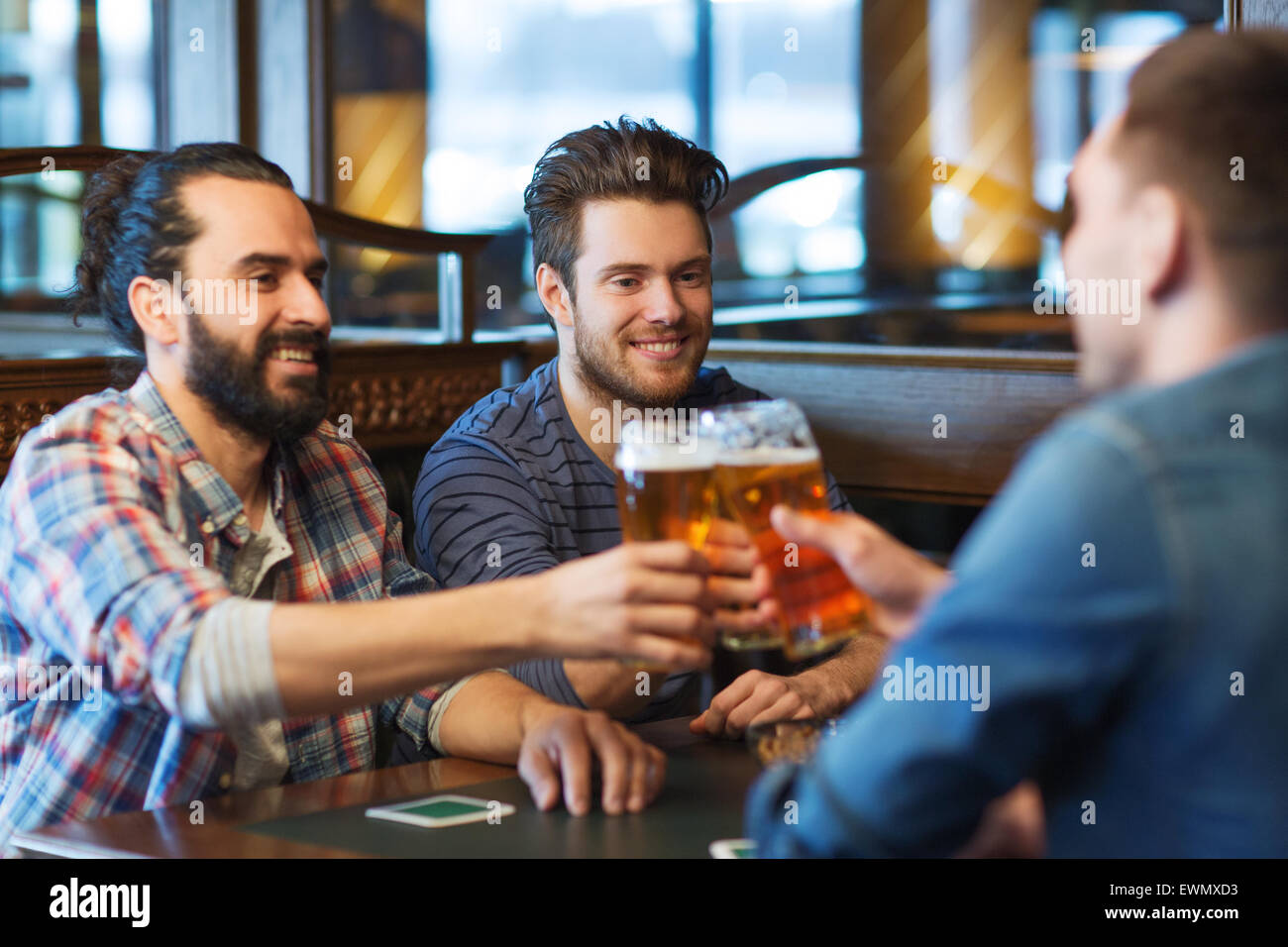 happy male friends drinking beer at bar or pub Stock Photo - Alamy