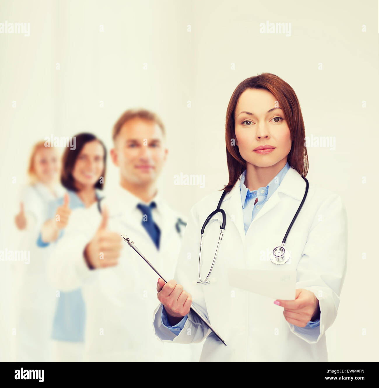 calm female doctor with clipboard Stock Photo - Alamy