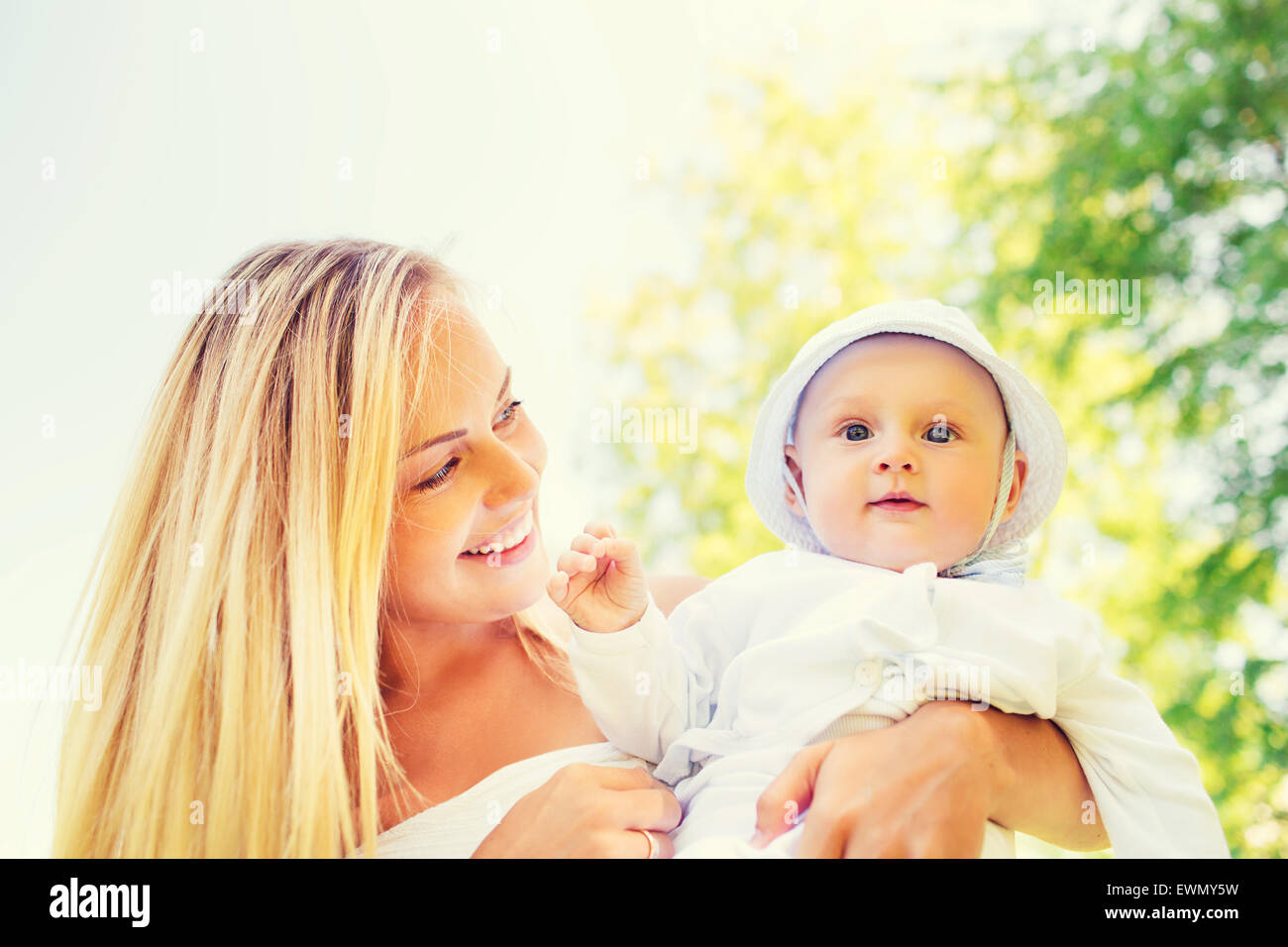 happy mother with little baby in park Stock Photo - Alamy