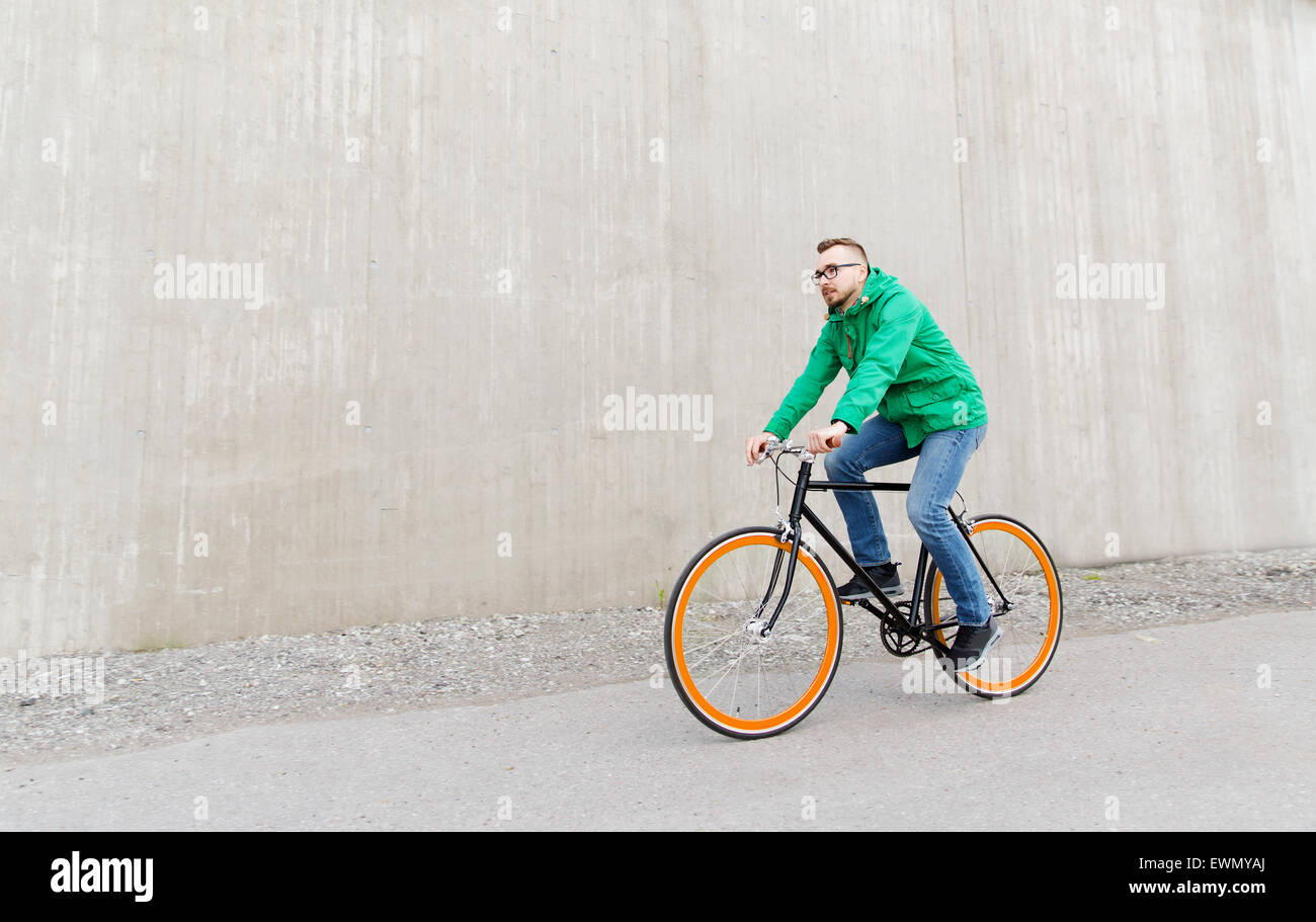 happy young hipster man riding fixed gear bike Stock Photo - Alamy