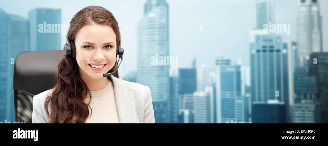 smiling female helpline operator with headset Stock Photo - Alamy