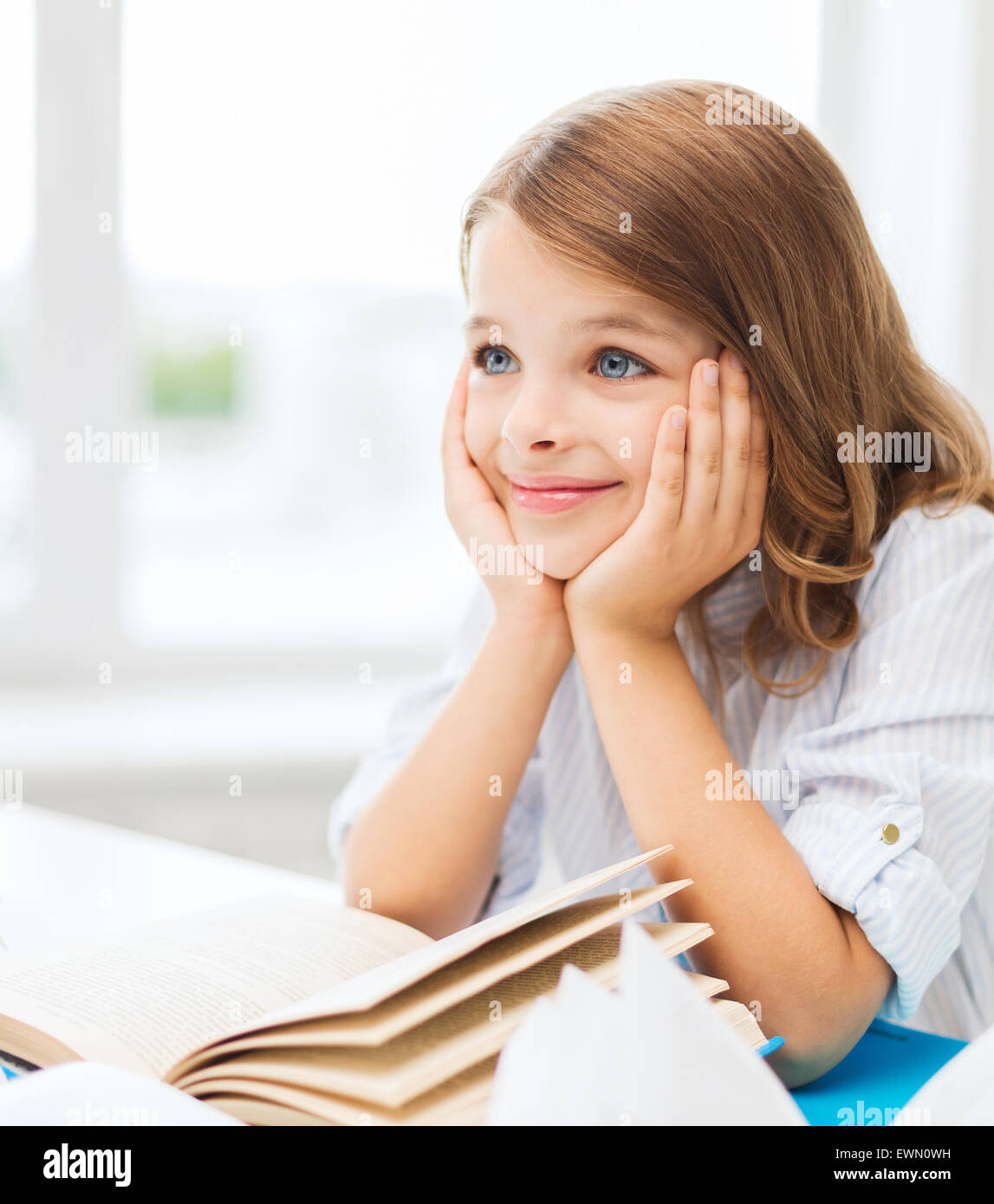 student girl writing in notebook at school Stock Photo - Alamy