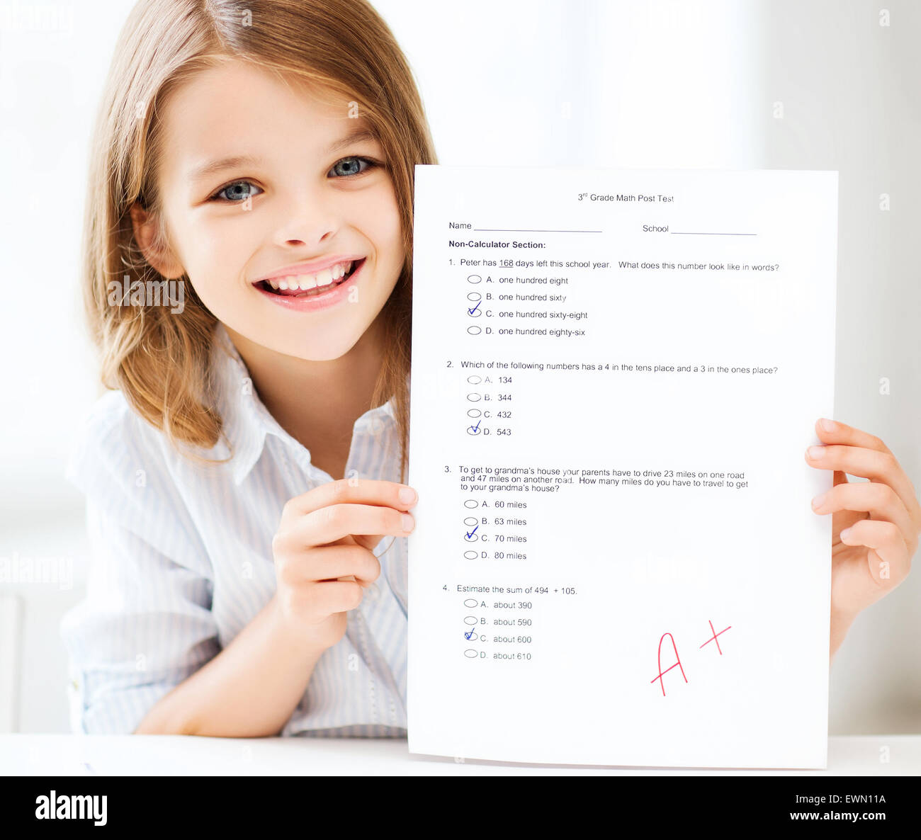 girl with test and grade at school Stock Photo - Alamy