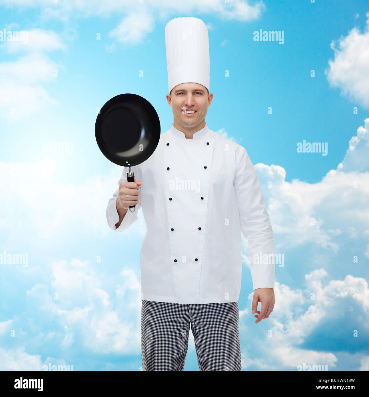 happy male chef cook holding frying pan Stock Photo - Alamy