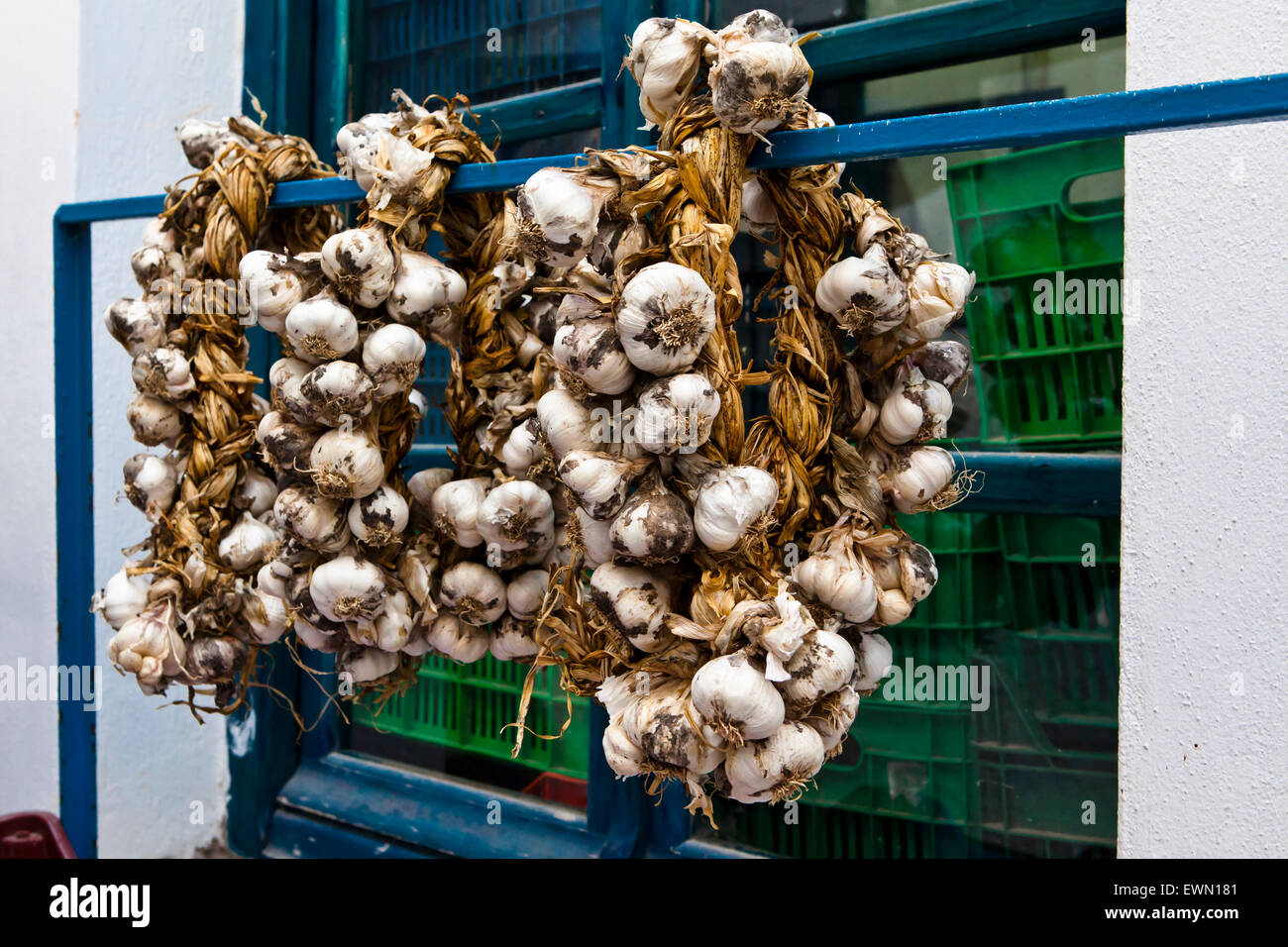 Hanging string of Garlic in Naxos in the Greek Islands Stock Photo - Alamy