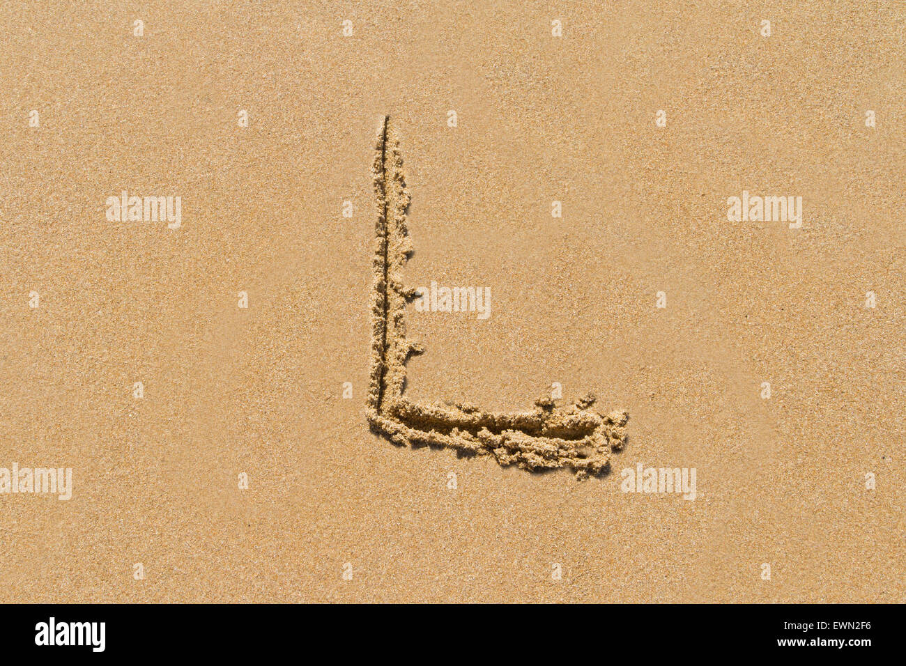 Letter L of the alphabet written on sand with upper case Stock Photo ...