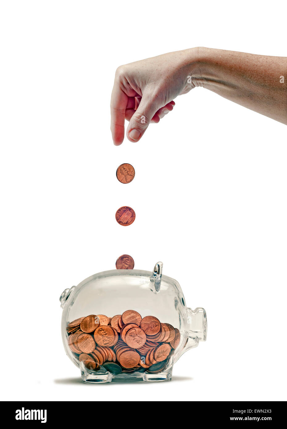 Hand dropping coins Cut Out Stock Images & Pictures - Alamy