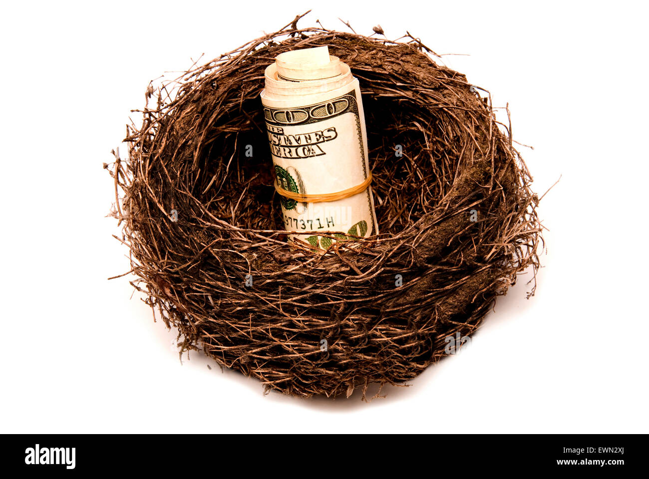 Retirement nest egg. Roll of hundreds as concept of retirement nest egg ...