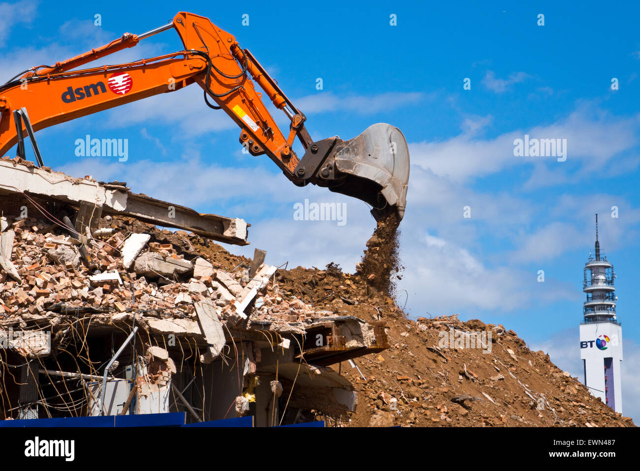 Digger demolition BT tower Stock Photo - Alamy