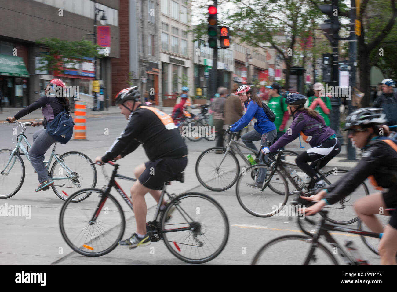 Bike riders crossing the traffic lights in the city of Montreal Stock ...