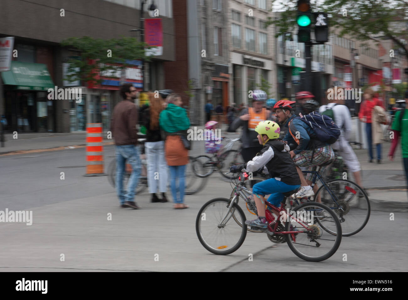 Bike riders crossing the traffic lights in the city, Montreal, Quebec ...