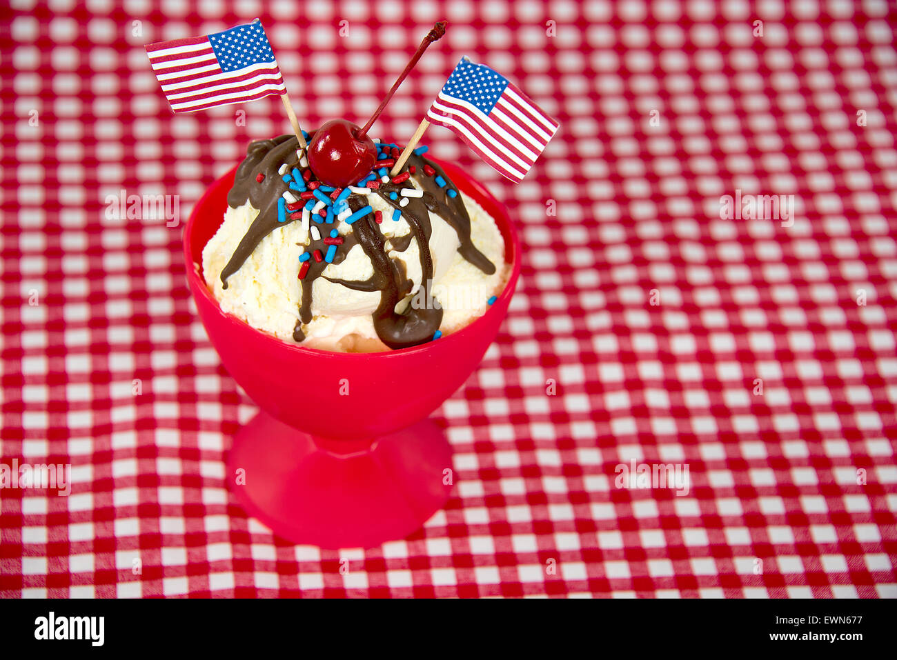 American flags on a hot fudge sundae with red, white and blue sprinkles ...