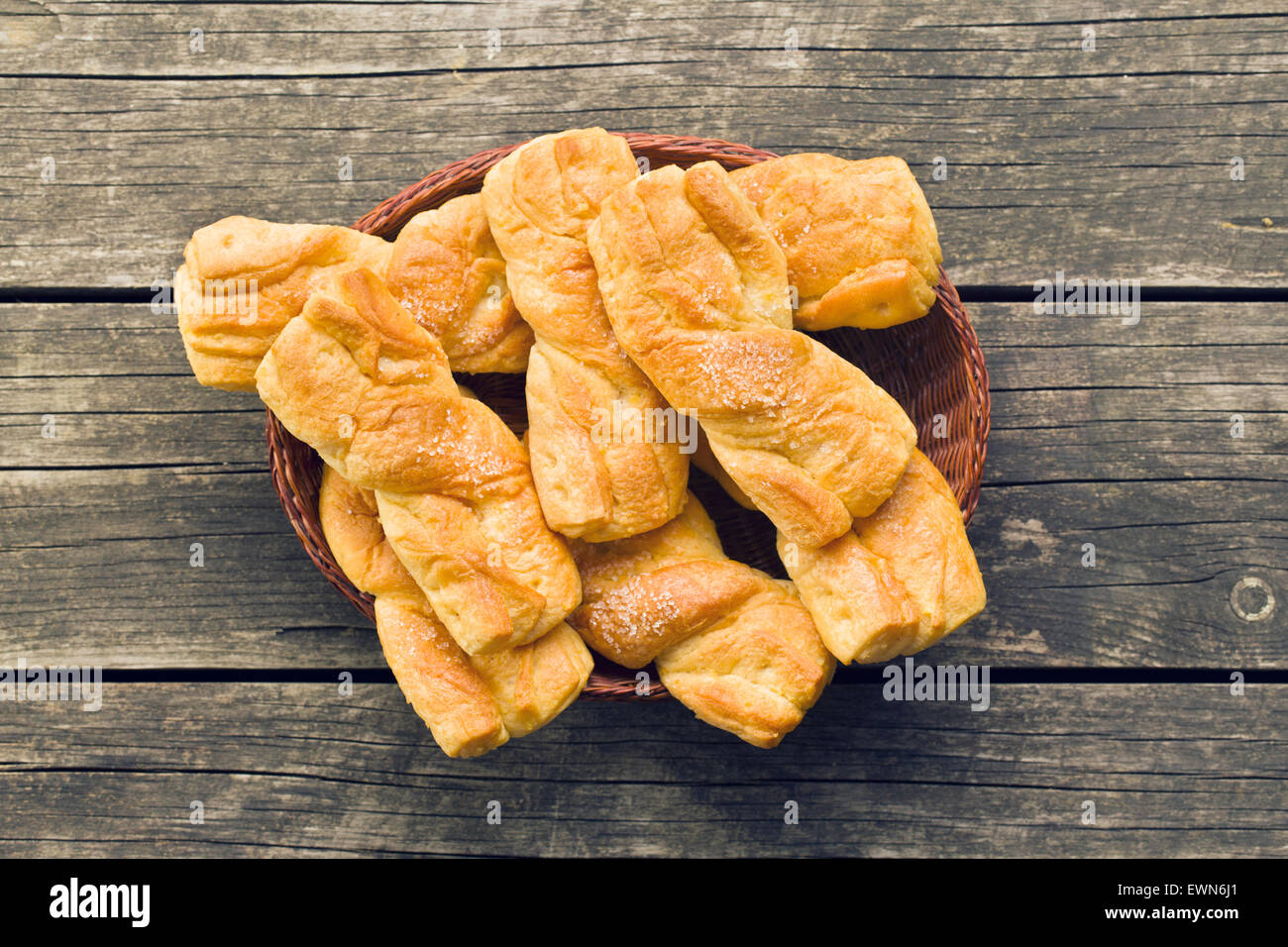 tasty baked bun on old table Stock Photo - Alamy