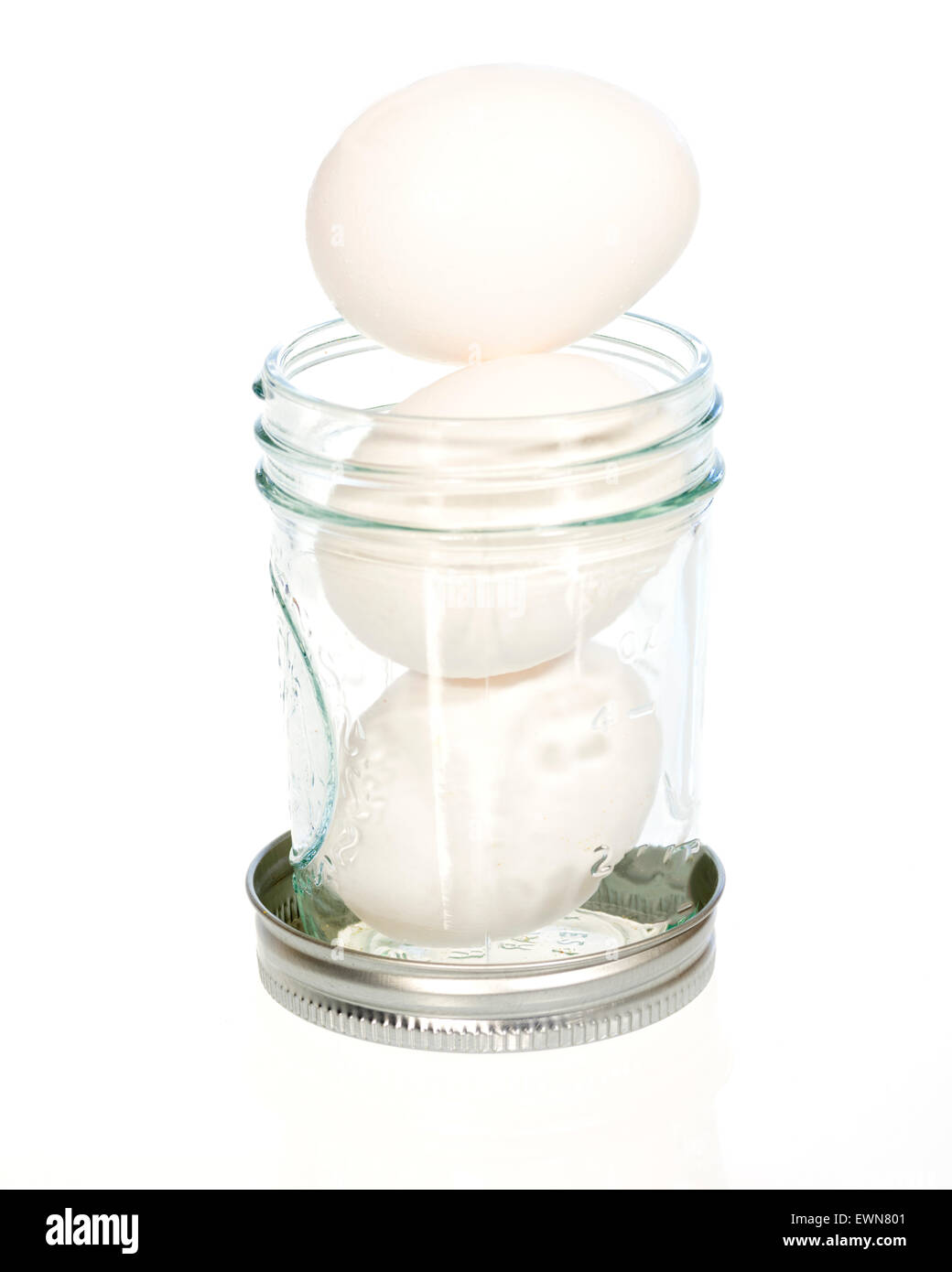 Three eggs in a jar Stock Photo - Alamy