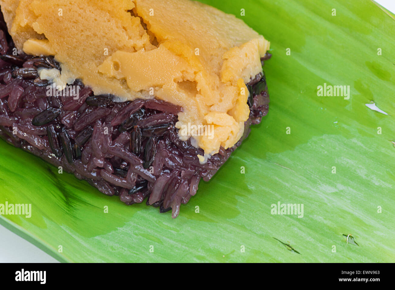 Black Sticky rice with custard, wrapped in banana leaves Stock Photo ...