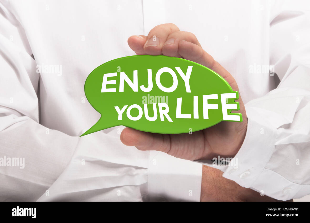 Man holding a green bubble withe the text enjoy your life, farewell or ...