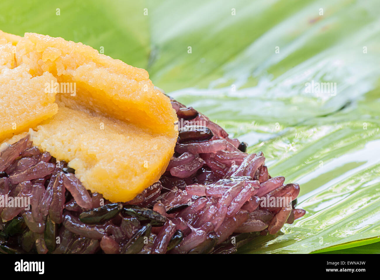 Black Sticky rice with custard, wrapped in banana leaves Stock Photo ...