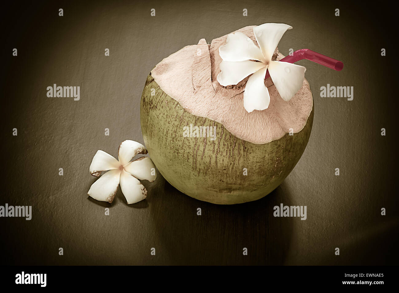 Coconut Water Drink with Plumeria Flower Stock Photo - Alamy