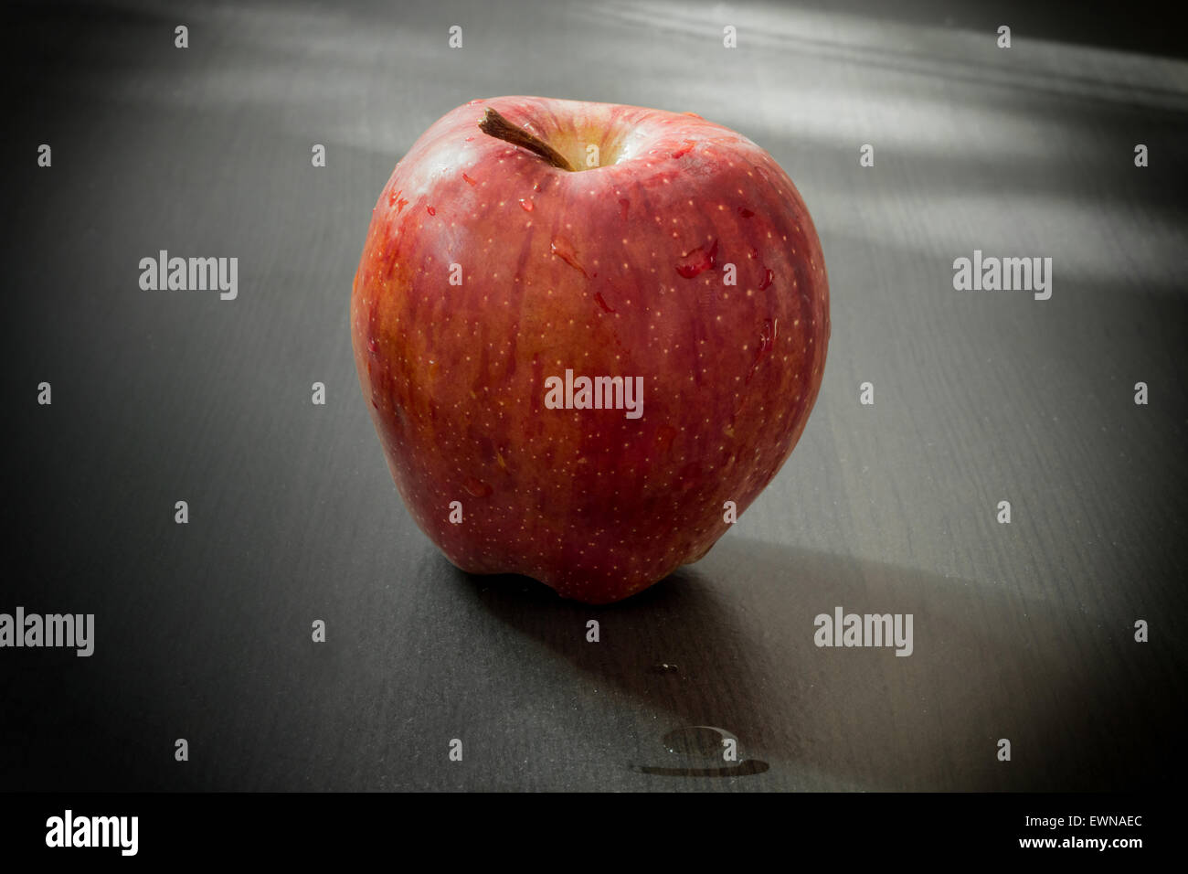 Apple on The Dark Background Stock Photo - Alamy