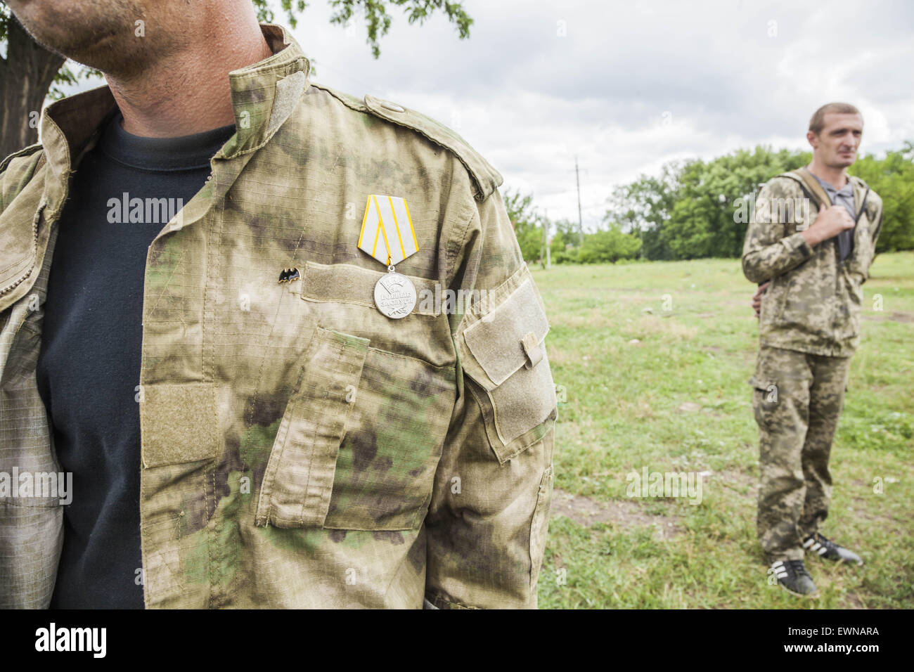 Volunteer with a medal of a battalion of the DPR army during a military ...