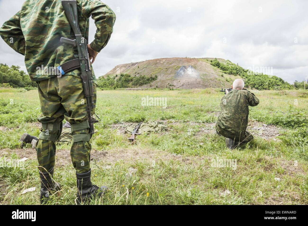 Soldier shoots under the surveillance of a military instructor of the ...