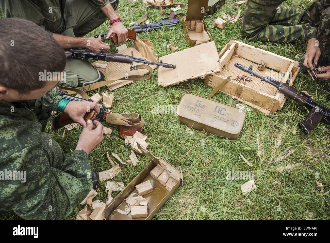 Soldiers of the DPR army charge ammunition during a military training ...