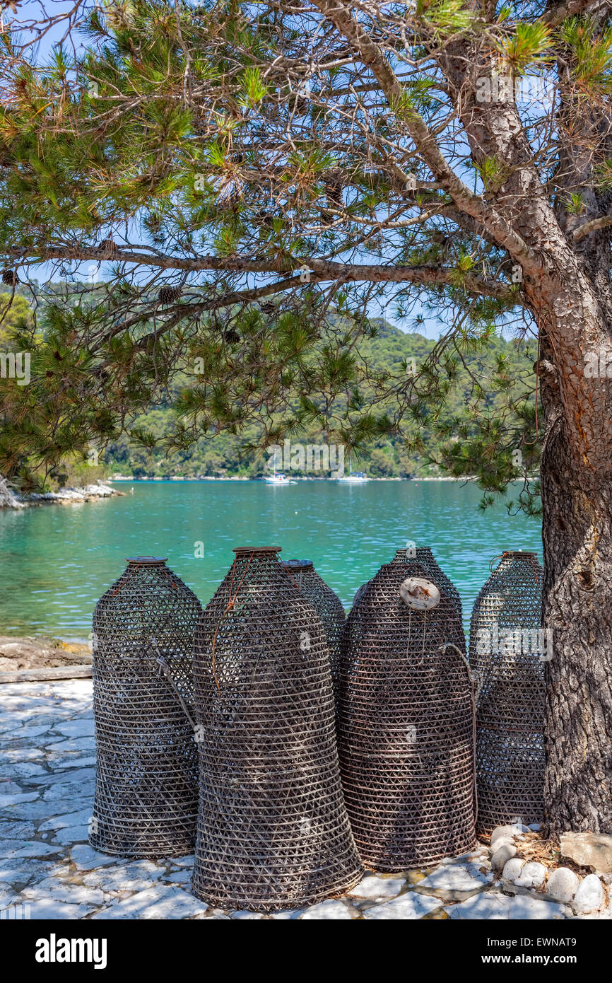 Sea fishing traps under the tree Stock Photo - Alamy