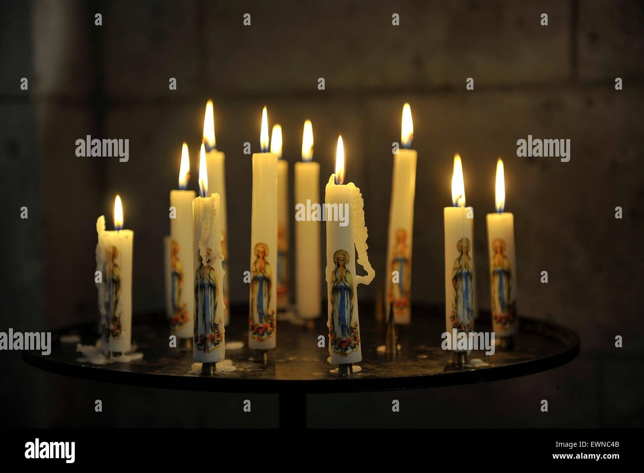 Igniting candles hi-res stock photography and images - Alamy